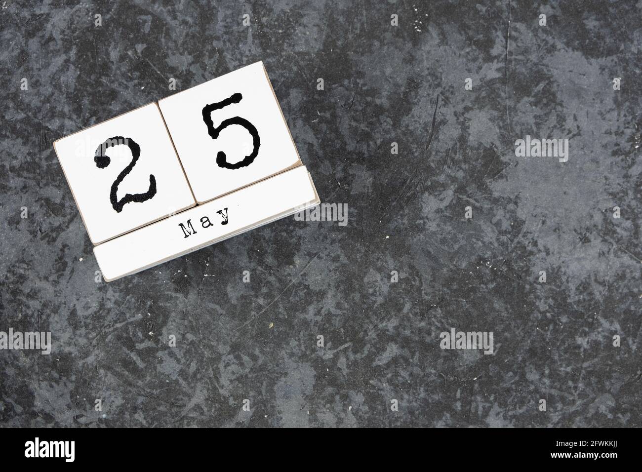 May 25th. May 25 white wooden cube calendar on grey grunge concrete ...