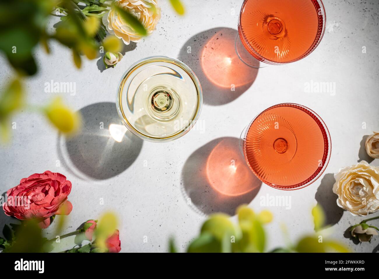 Sparkling wine or champagne glasses on white background with sharp ...