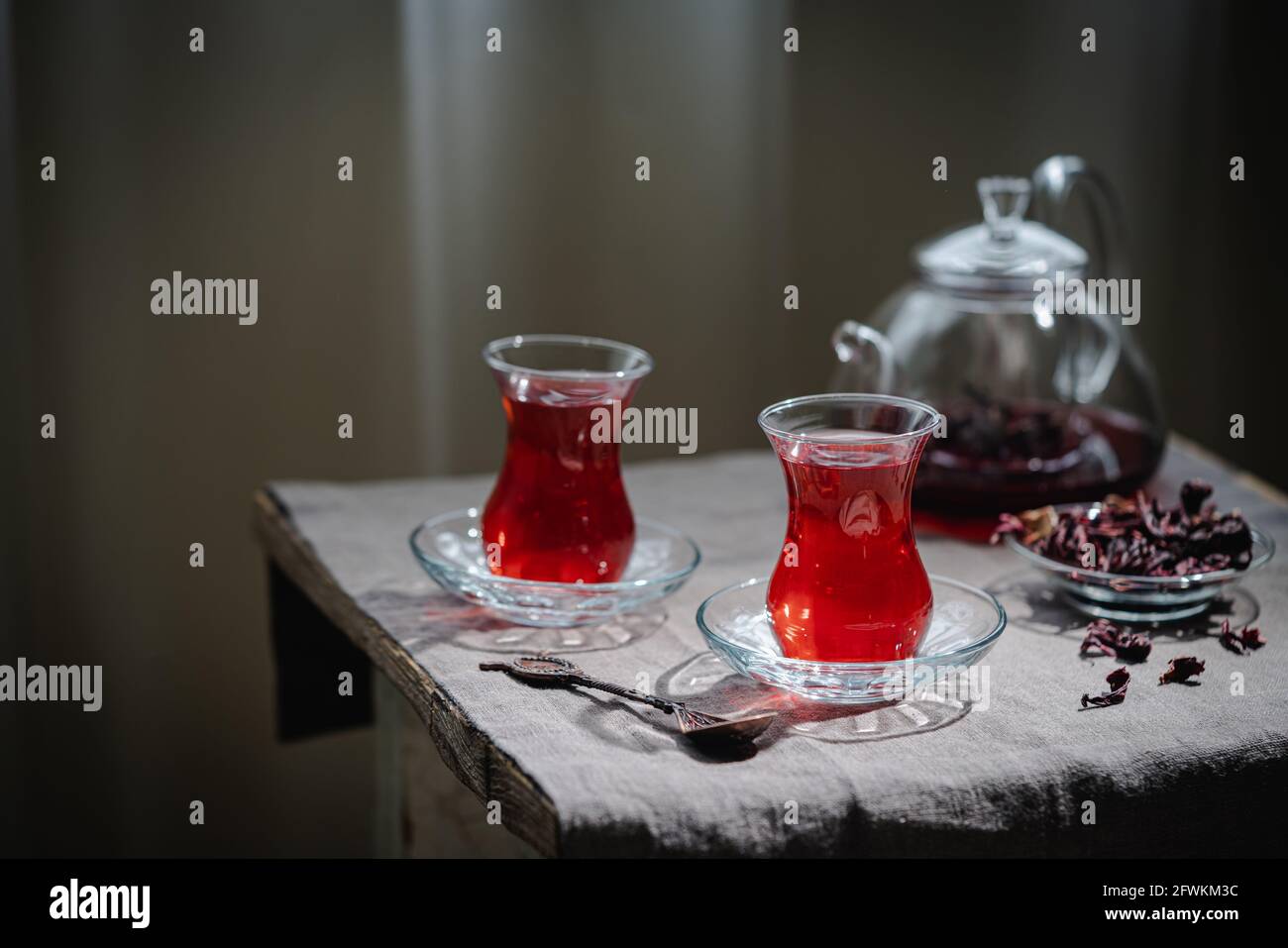 Hot red karkade tea in a glasses on rustic background Stock Photo - Alamy