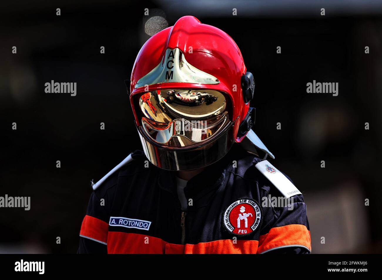 Nikita Mazepin (RUS) Haas F1 Team VF-21 reflected in a fire marshal's ...