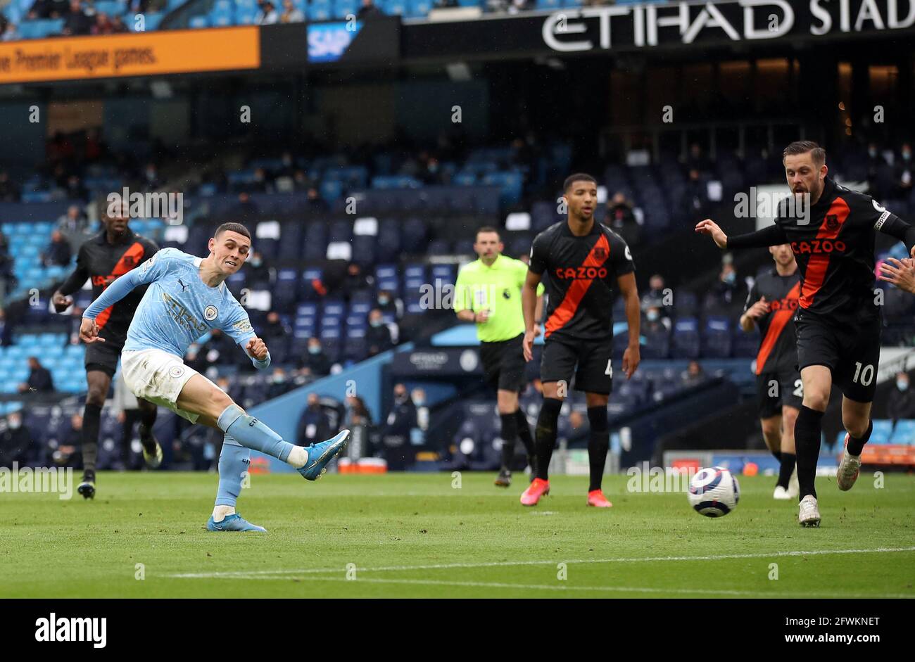Manchester City's Phil Foden scores their side's third goal of the game ...