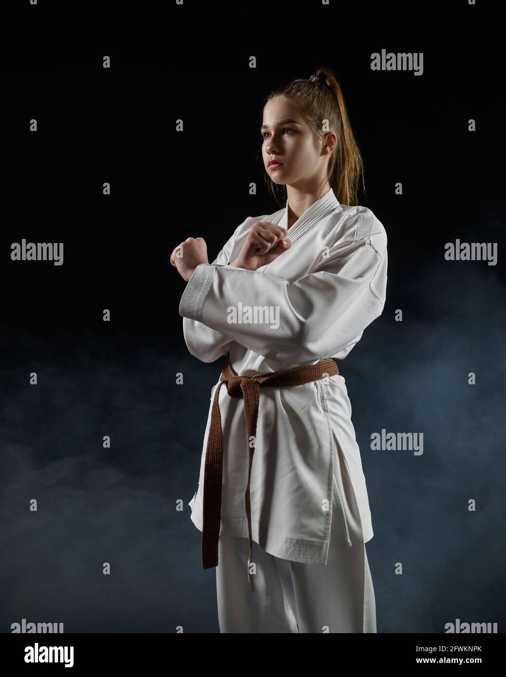 Male karate fighter in white kimono, welcome sign Stock Photo - Alamy