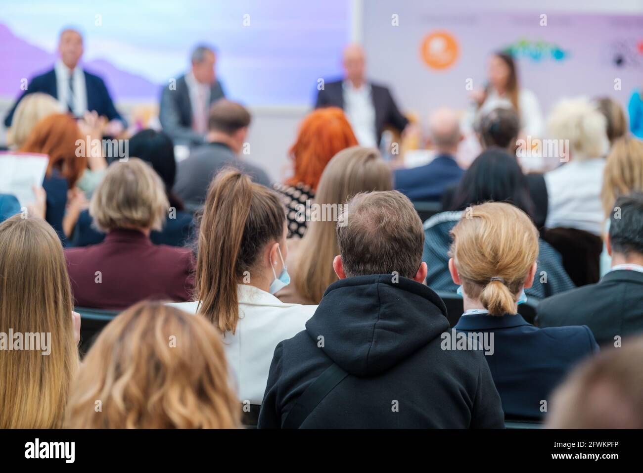 Anonymous people listening to presentation during conference Stock ...
