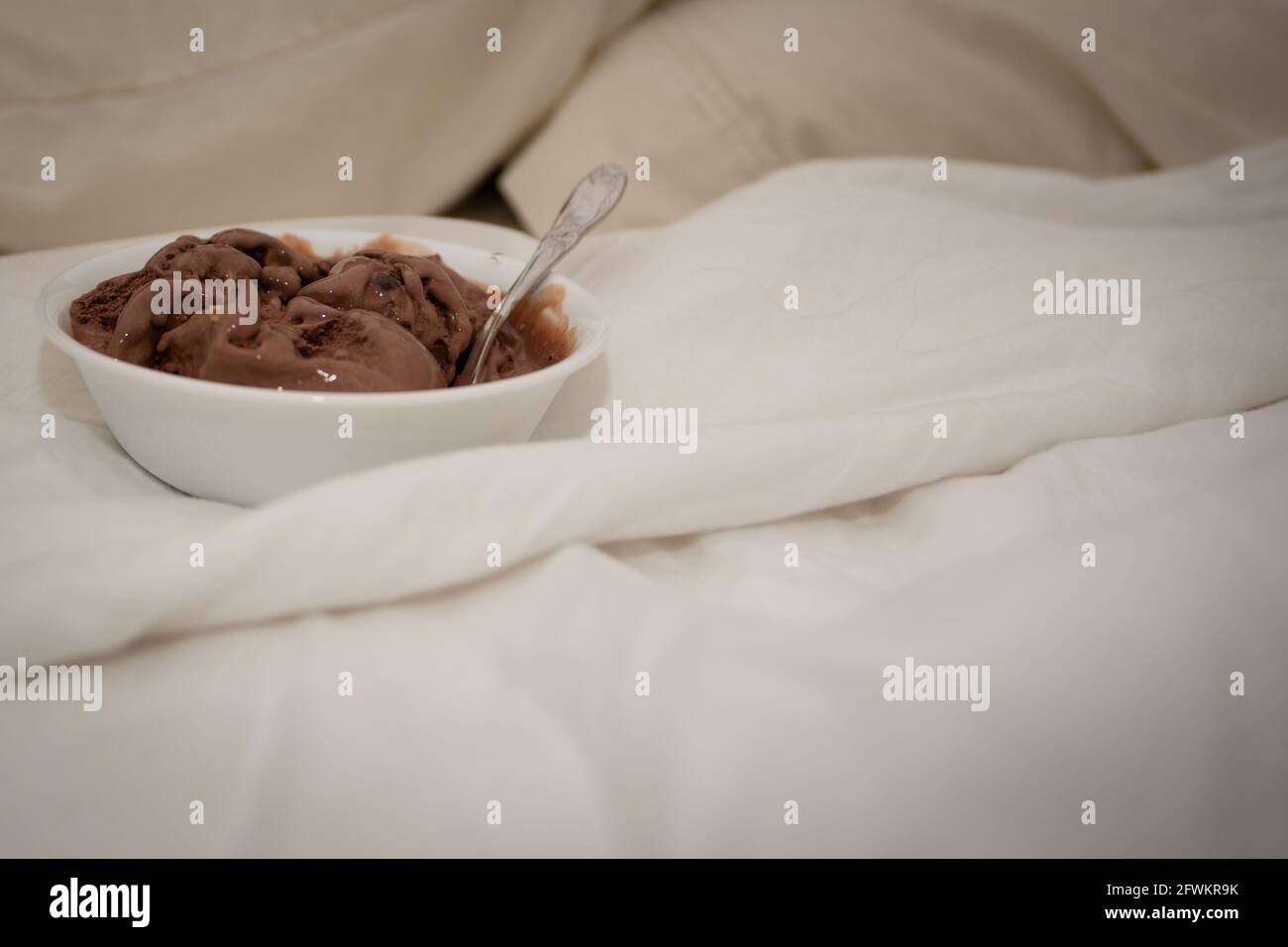 Melted Bowl of ICe Cream showing Depression Stock Photo - Alamy