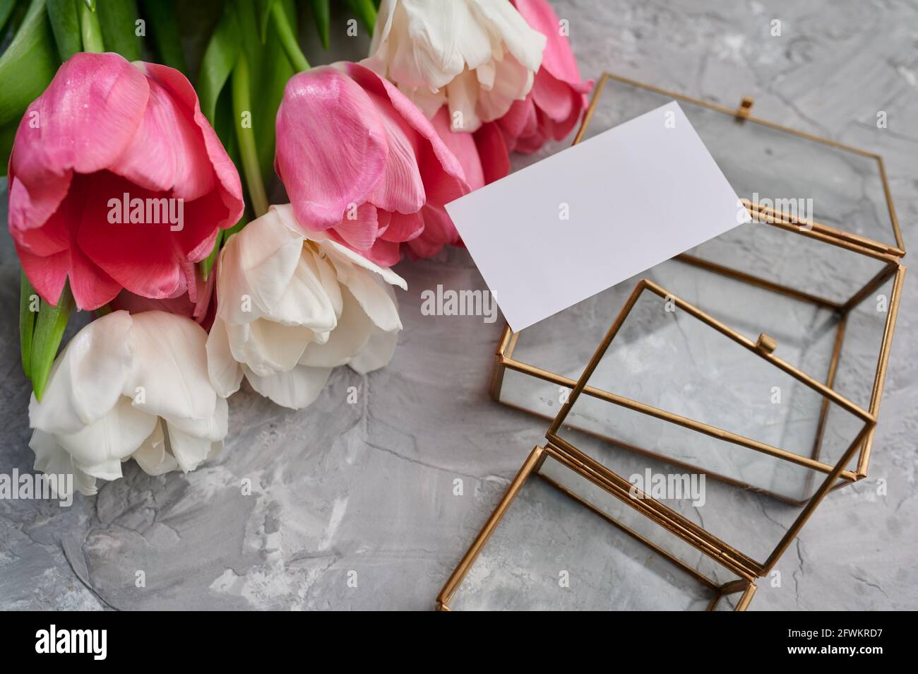 Tulips frame and greeting card on grey background Stock Photo - Alamy