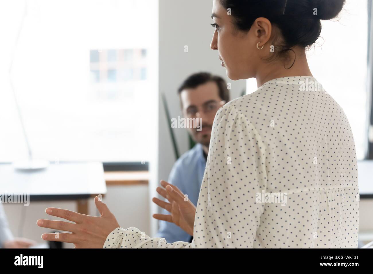 Close up back view Indian businesswoman mentor leading briefing Stock ...