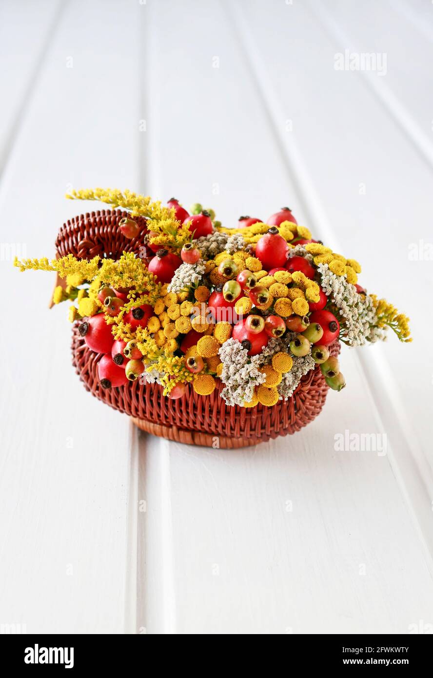 Bouquet of flowers in wicker goose. Table centerpiece idea for St ...
