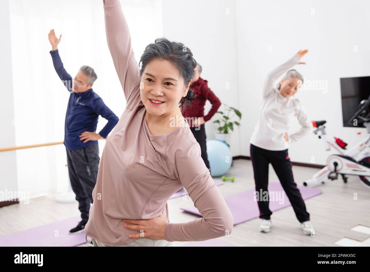 A fitness exercise of the elderly Stock Photo - Alamy