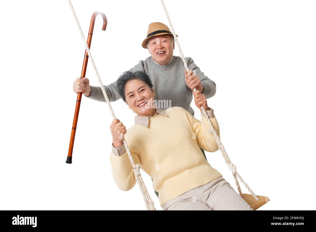 Couple on swing Cut Out Stock Images & Pictures - Alamy