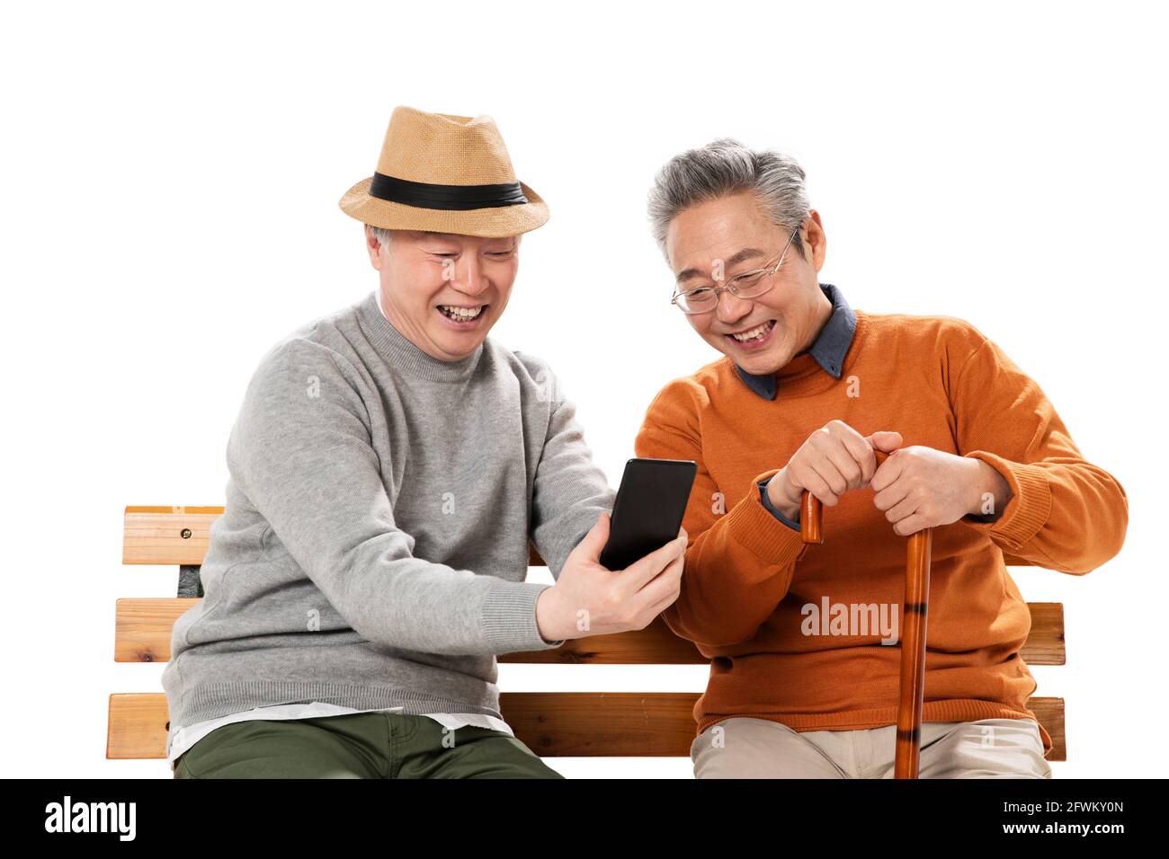 Two old men talking on a bench hi-res stock photography and images - Alamy