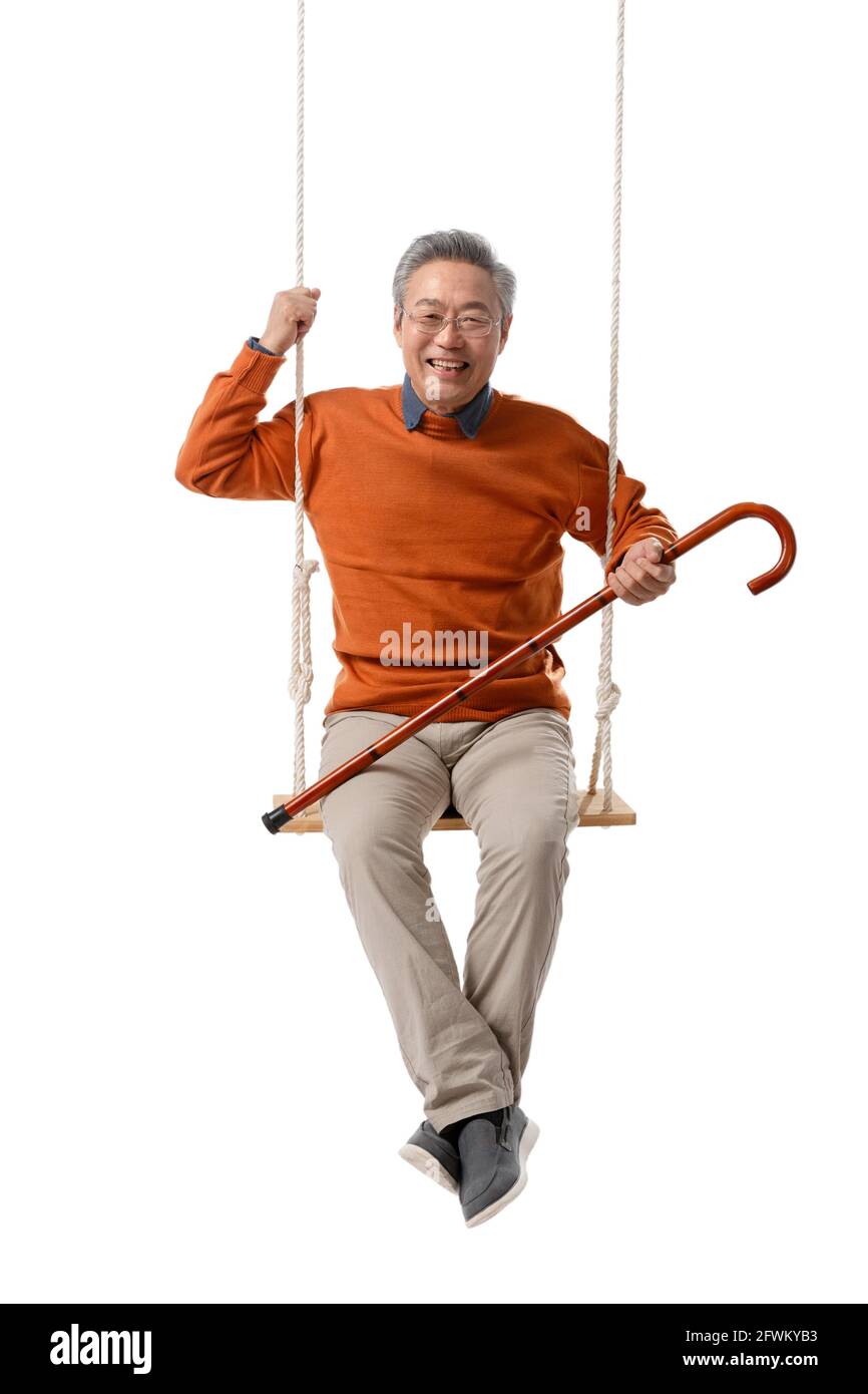 Happy old man on the swings Stock Photo - Alamy