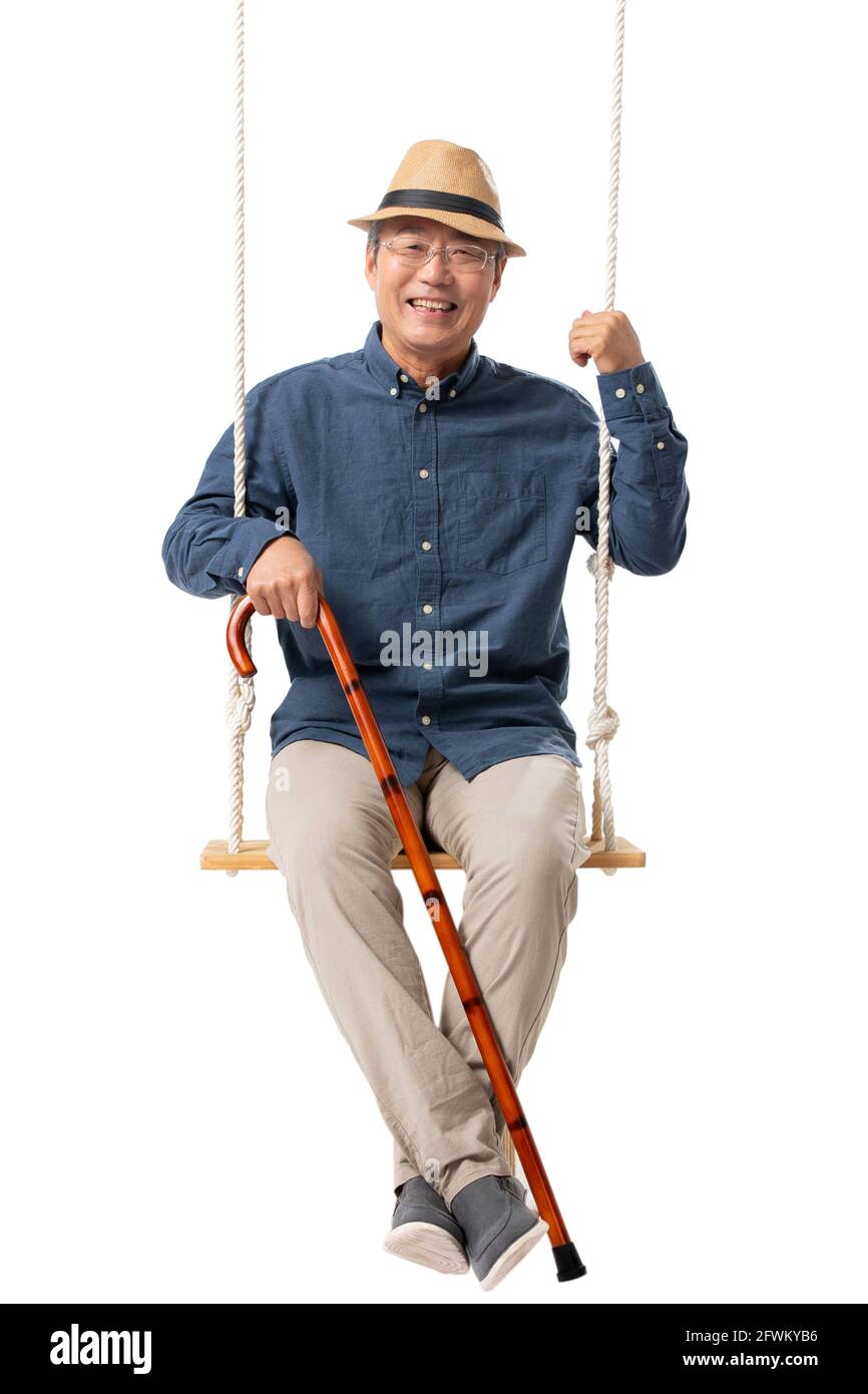 Happy old man on the swings Stock Photo - Alamy