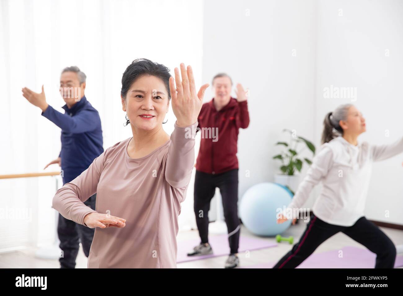 A fitness exercise of the elderly Stock Photo - Alamy