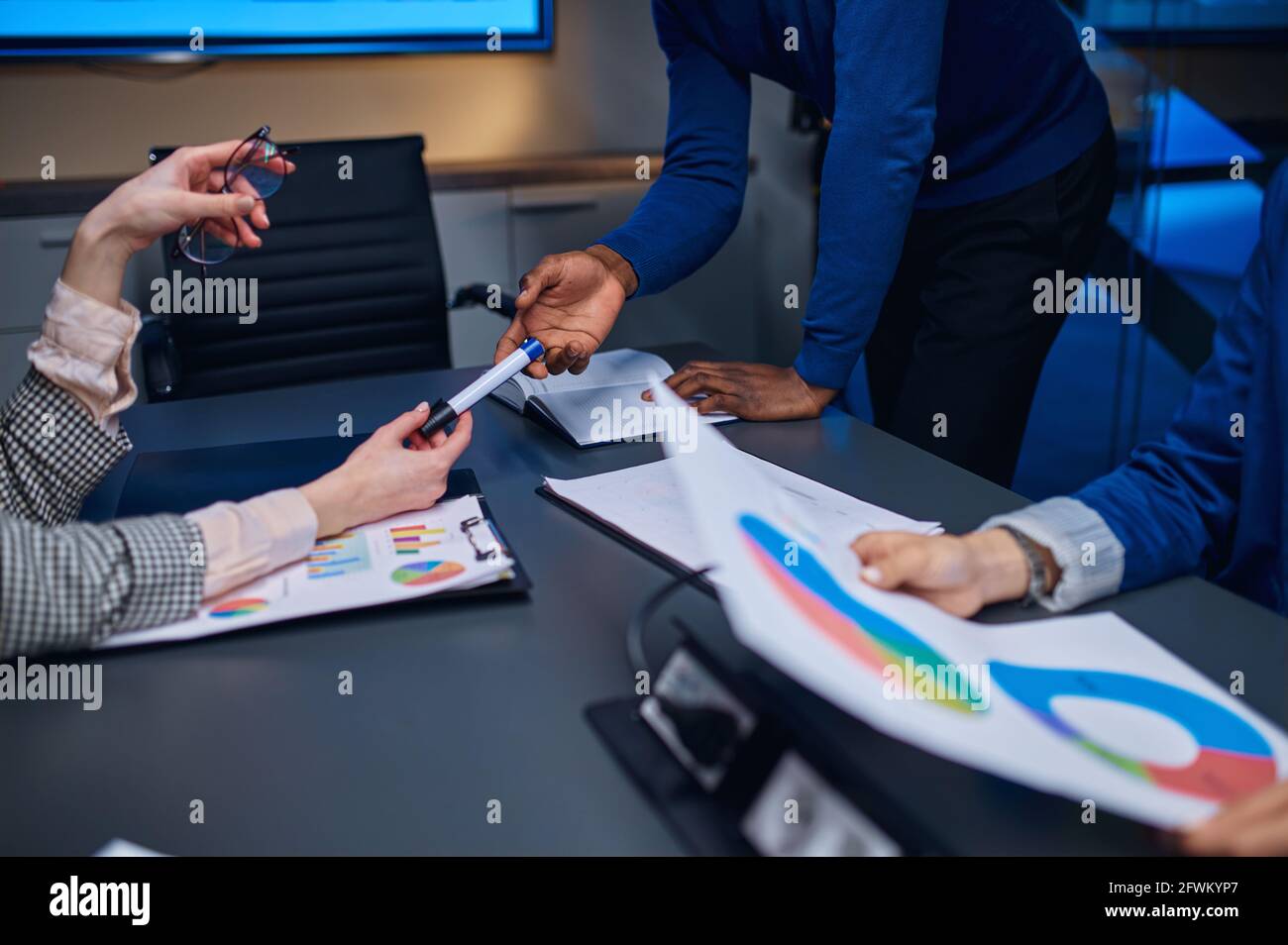 Managers on business negotiations in night office Stock Photo - Alamy