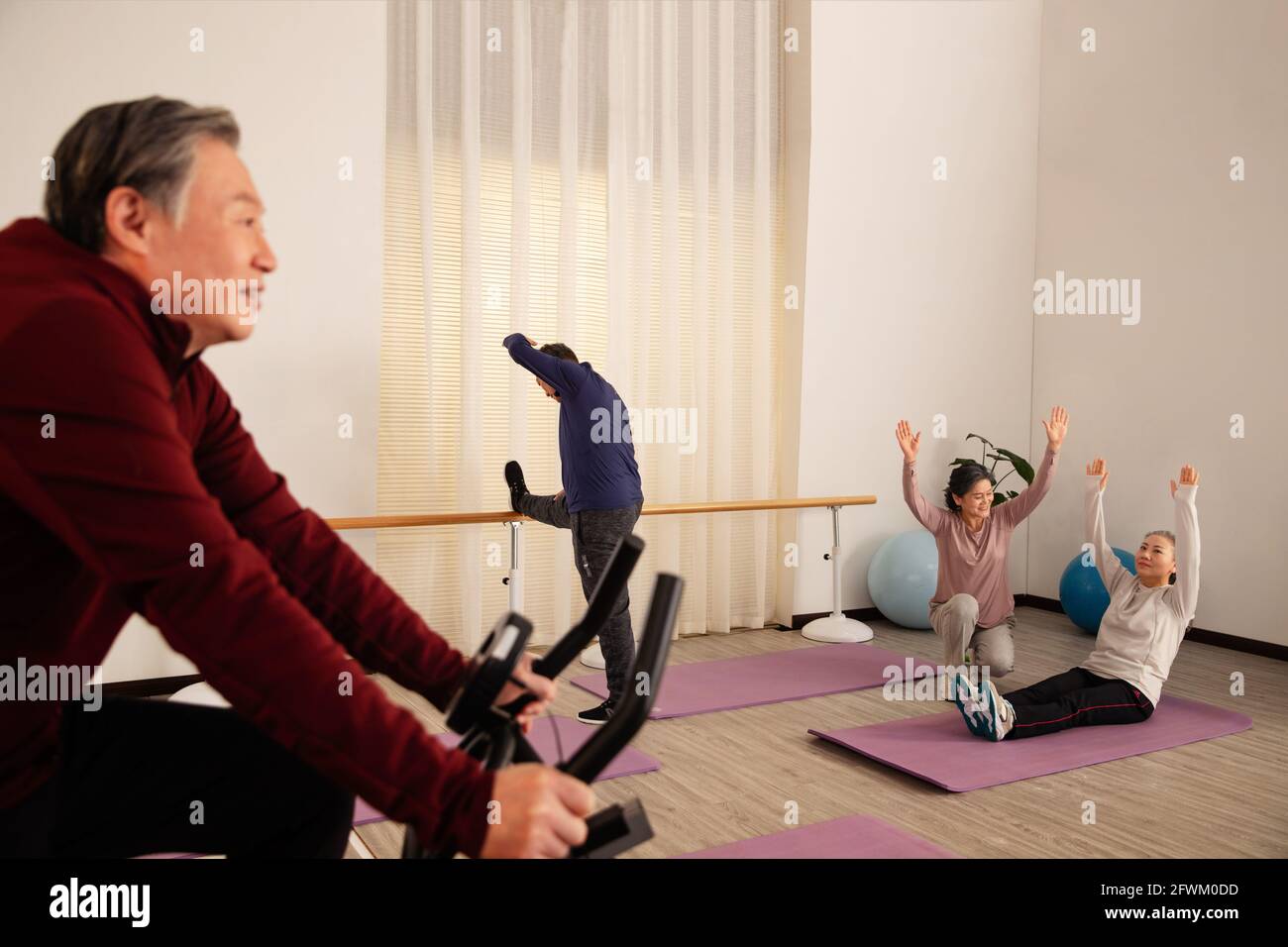 A fitness exercise of the elderly Stock Photo - Alamy