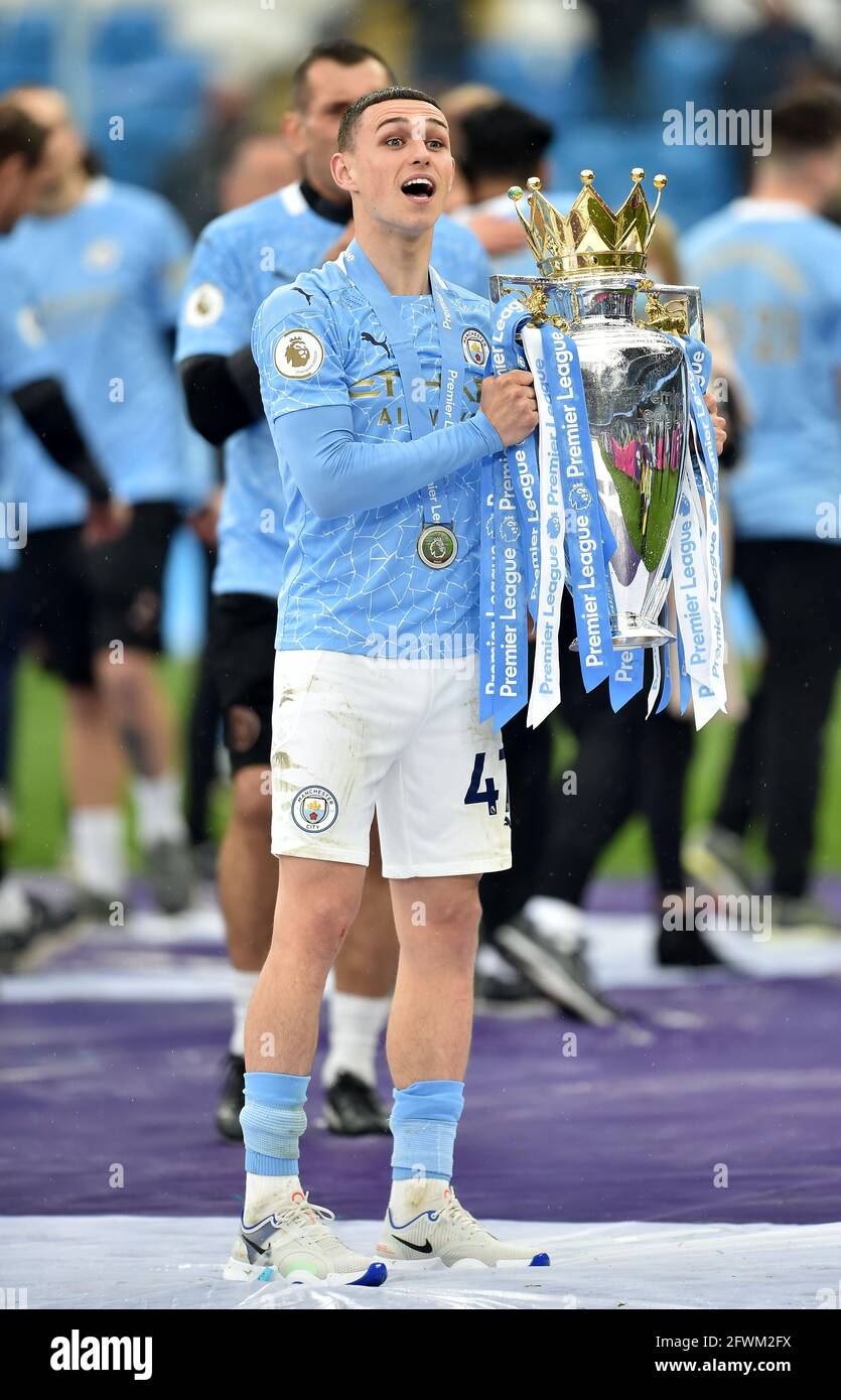 Manchester City's Phil Foden celebrates with the trophy after the ...