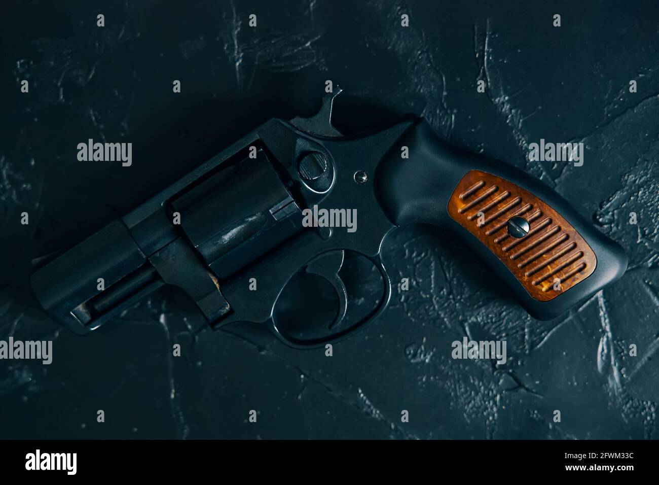 Top view of retro pistol. Vintage gun on concrete textured table ...