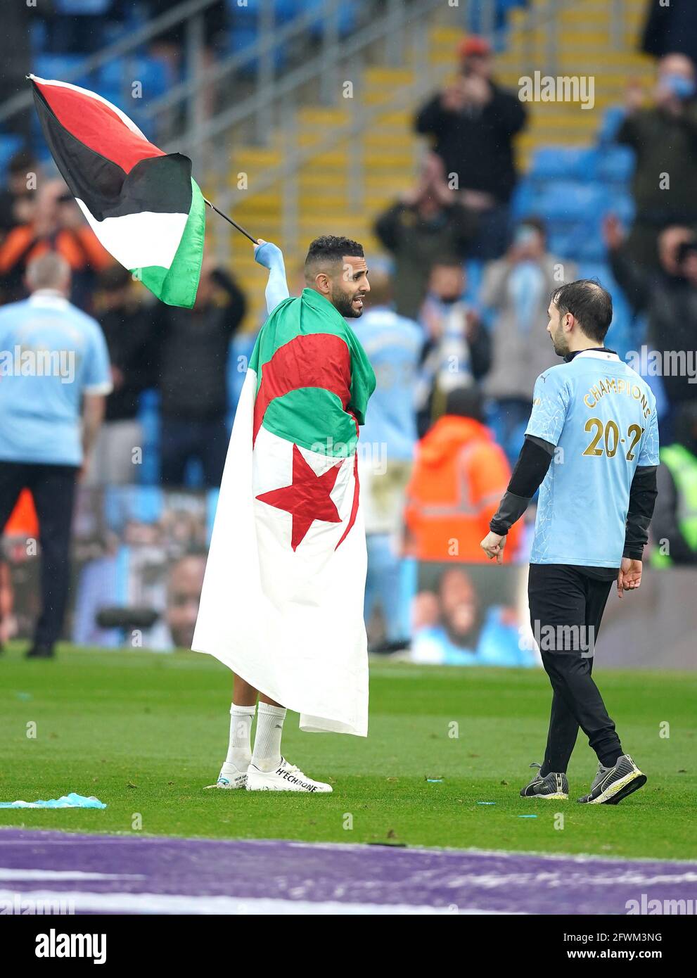 Manchester City's Riyad Mahrez with a Palestine flag after winning the ...