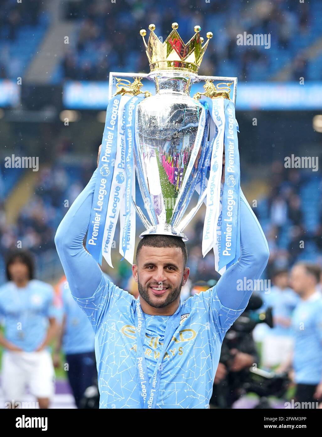 Manchester City's Kyle Walker celebrates with the Premier League trophy ...
