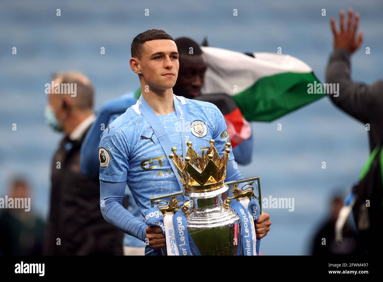 Manchester City's Phil Foden with the trophy after the Premier League ...