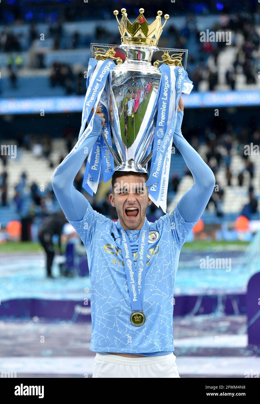 Manchester City's Ferran Torres poses with the trophy after the Premier ...