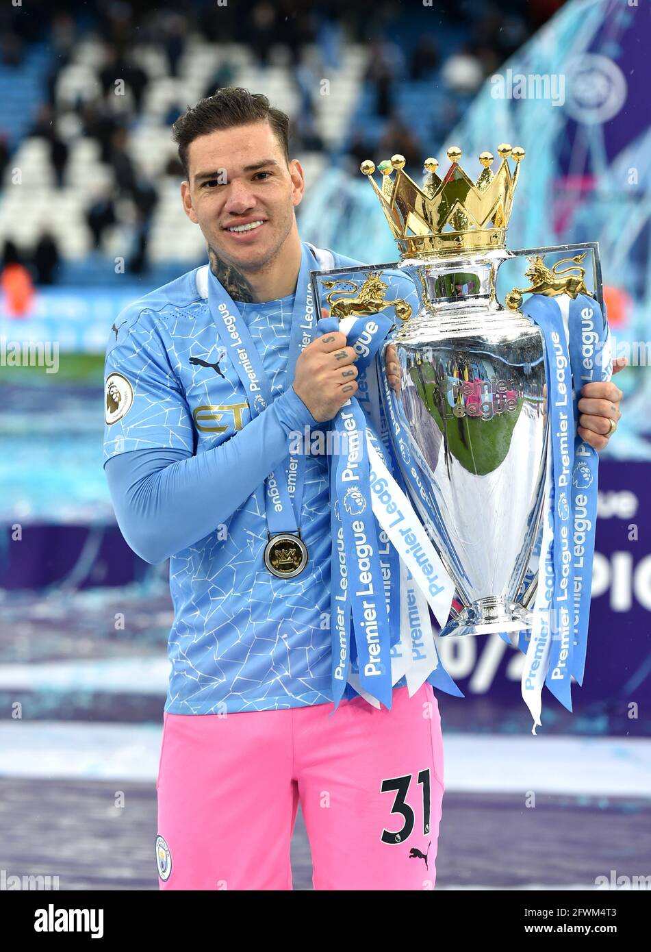 Manchester City goalkeeper Ederson celebrates with the trophy after the ...