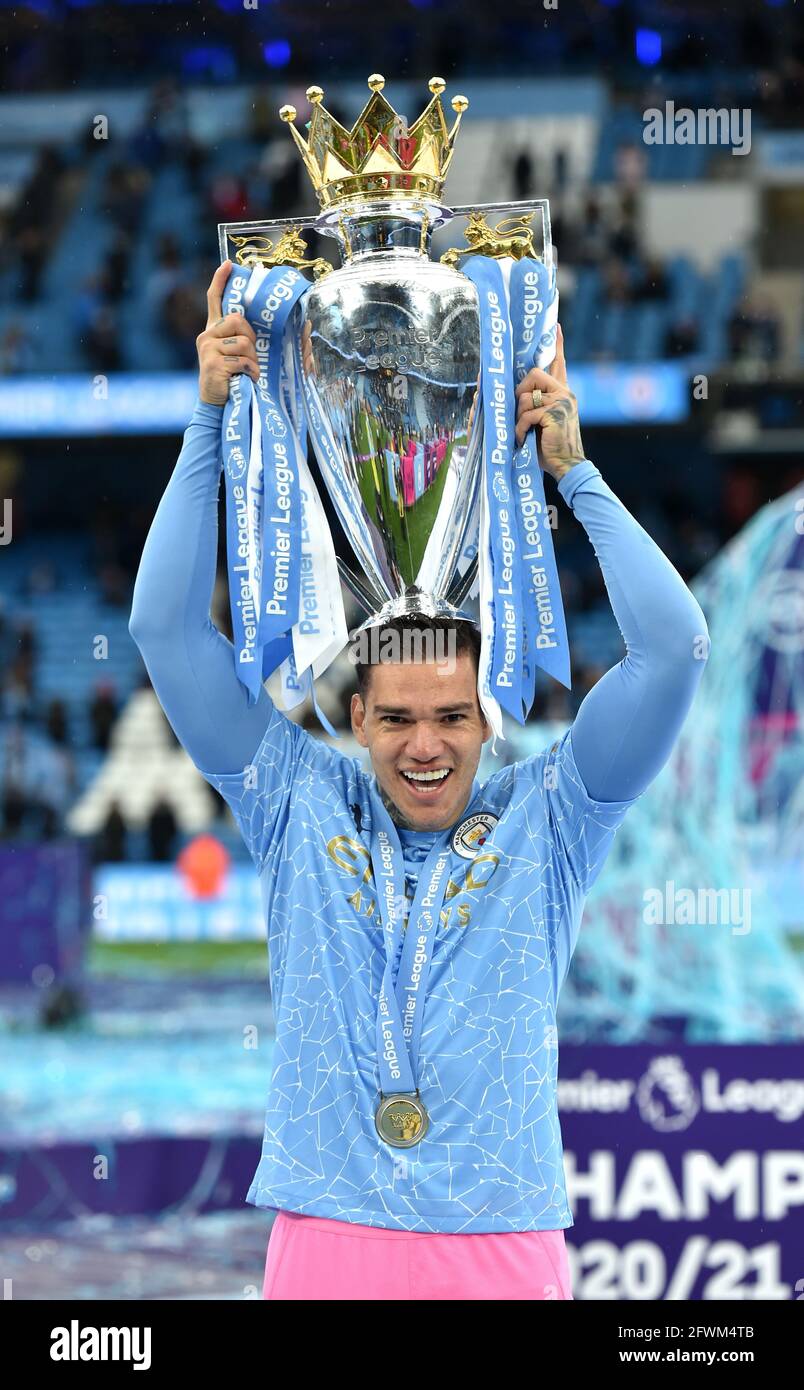 Manchester City goalkeeper Ederson celebrates with the trophy after the ...