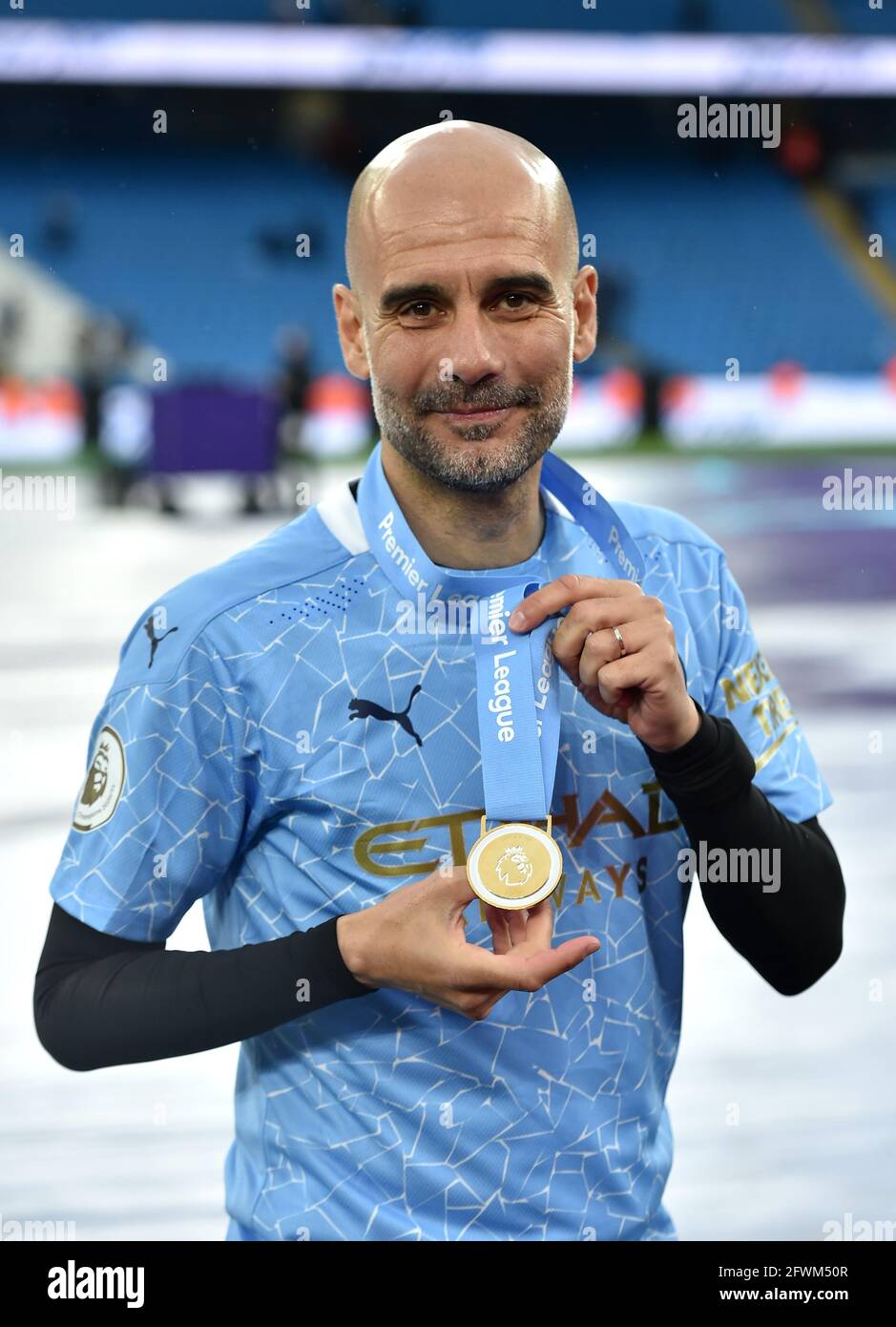Manchester City manager Pep Guardiola poses with his winners medal ...