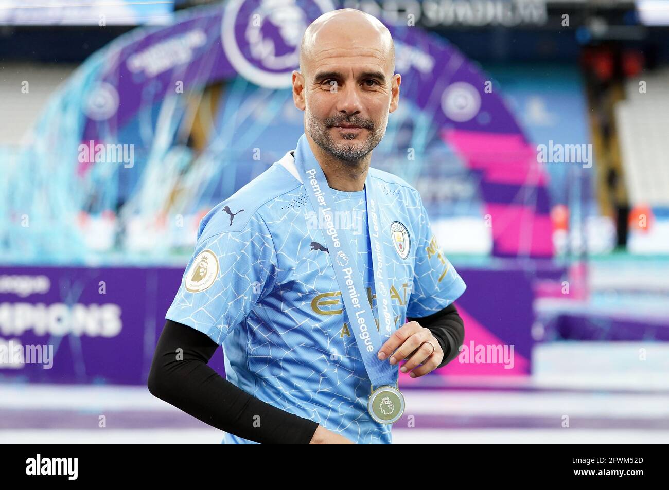 Manchester City manager Pep Guardiola smiles after winning the Premier ...