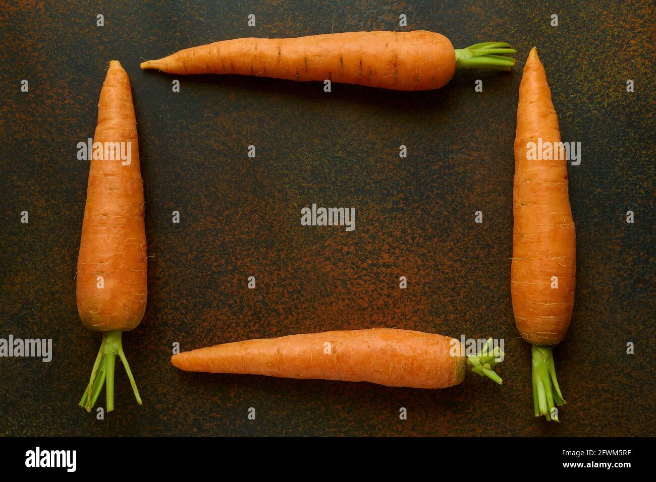 Fresh carrot frame on dark background with copy space Stock Photo - Alamy