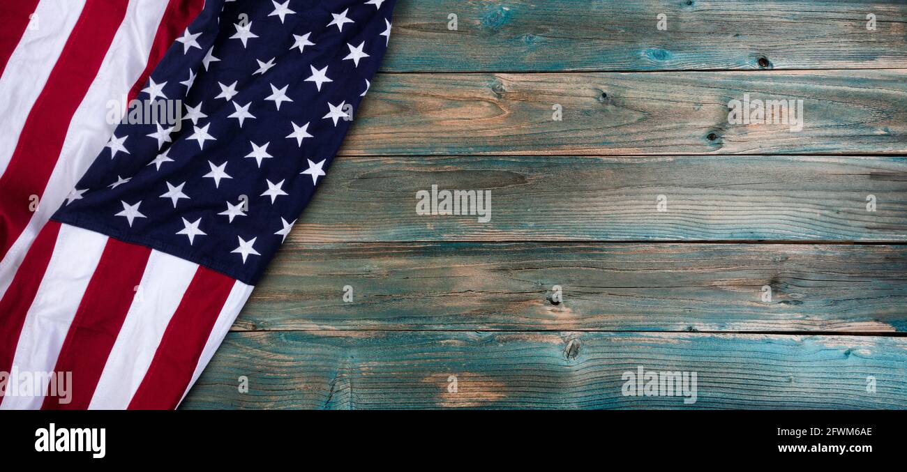 Waving American flag on left side of faded blue wooden planks for happy ...