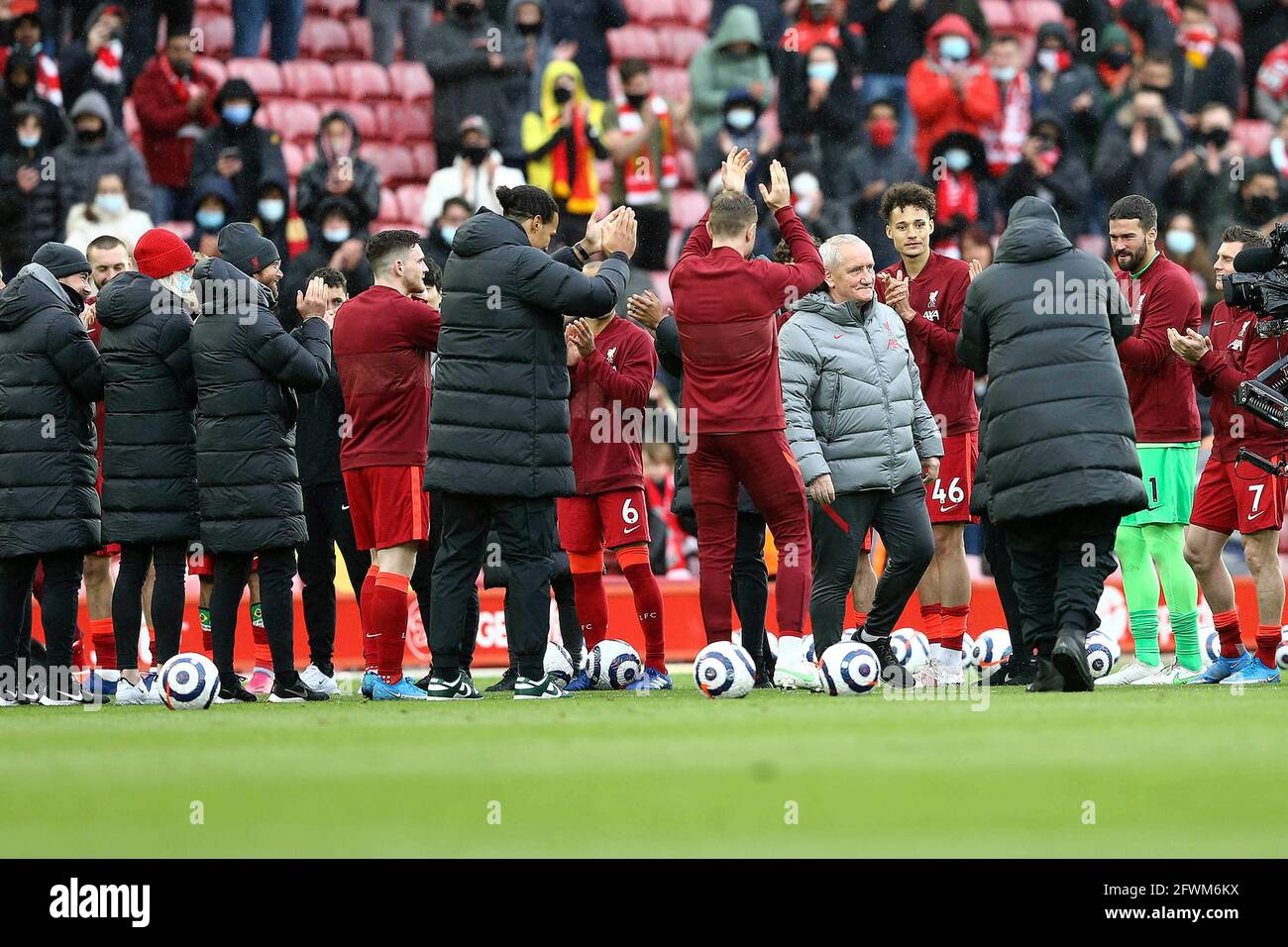 Liverpool, UK. 23rd May, 2021. Liverpool Kit Man Graham Carter receives ...