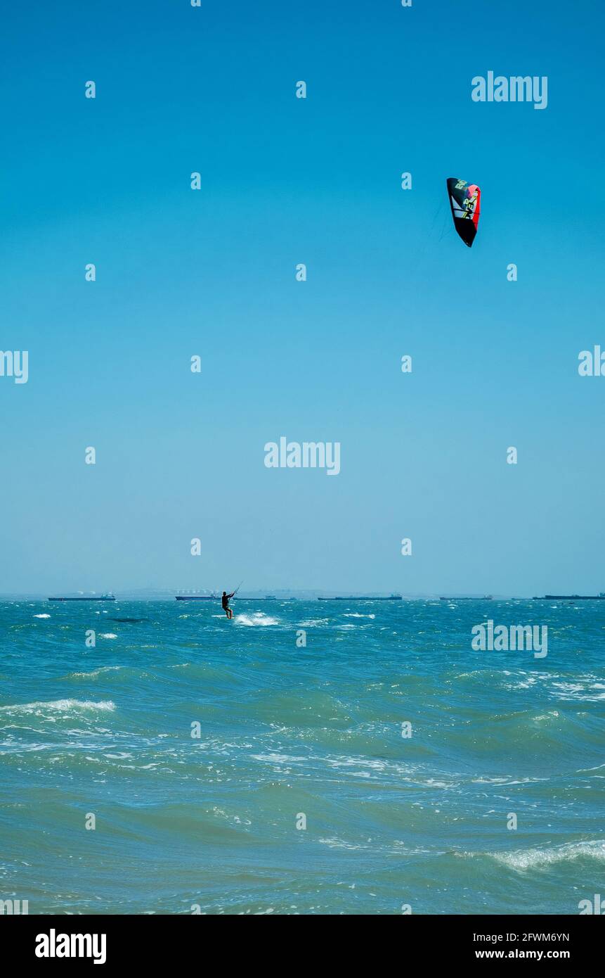 Aerial view. Kite surfing on the blue sea in the background of blue sky ...