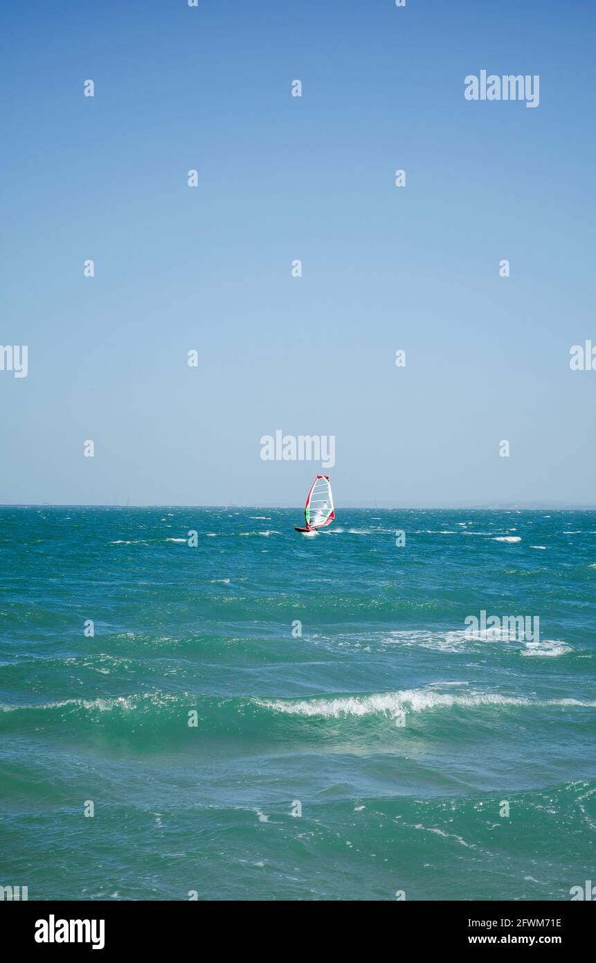 Aerial view. Kite surfing on the blue sea in the background of blue sky ...