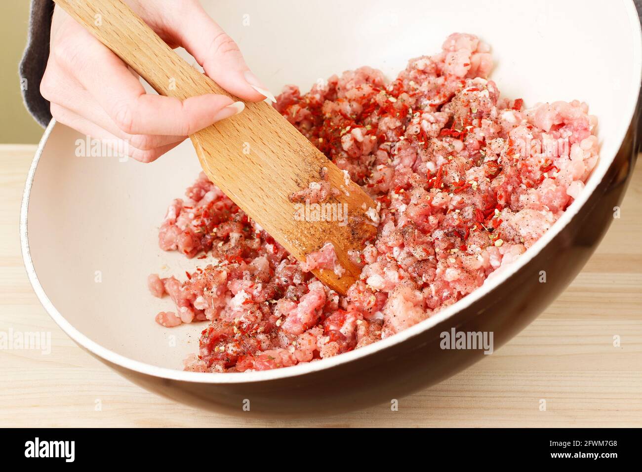 Minced meat with spices in a pan. Dinner cooking Stock Photo - Alamy