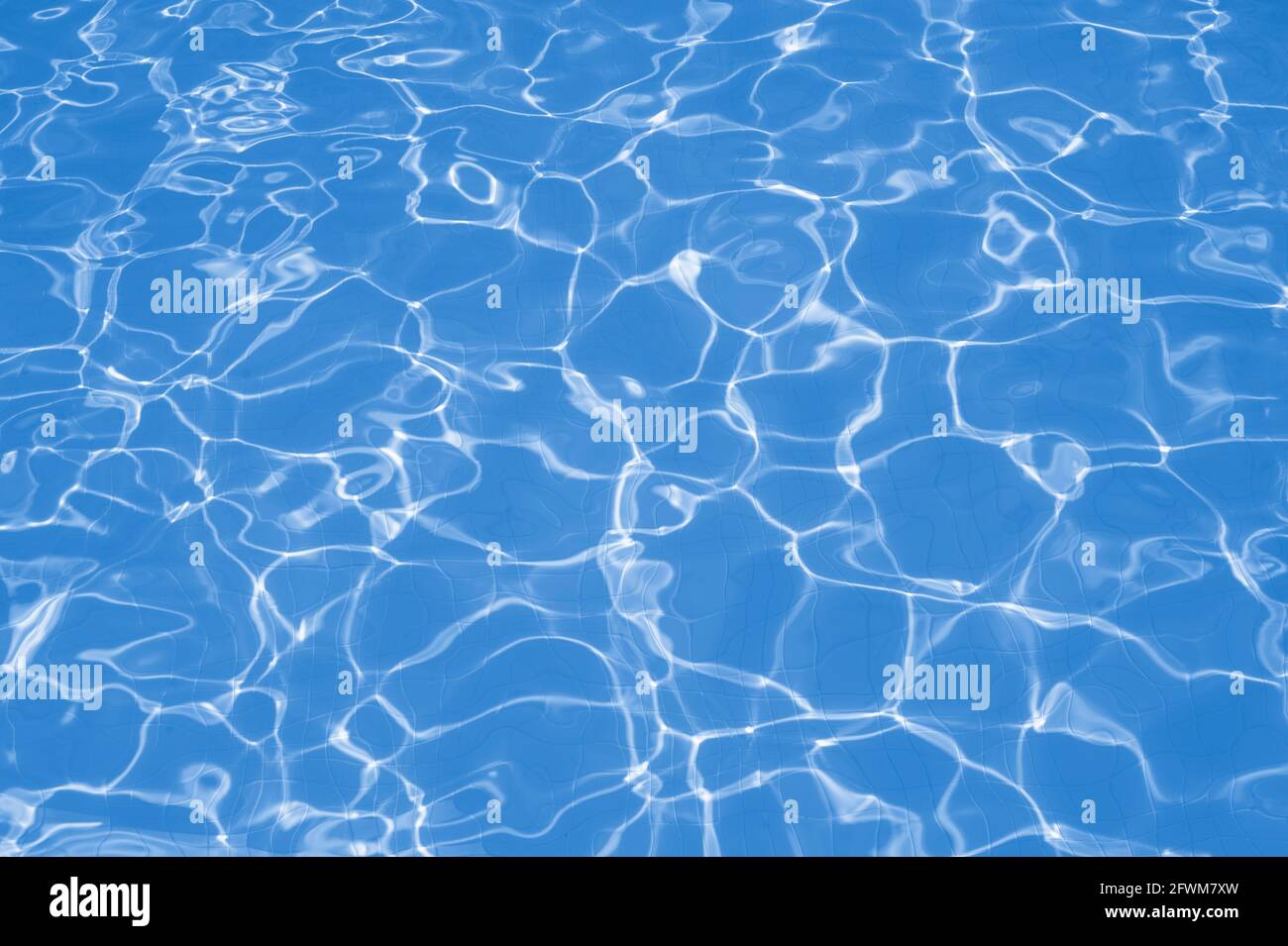 Water in swimming pool with sun reflection Stock Photo - Alamy