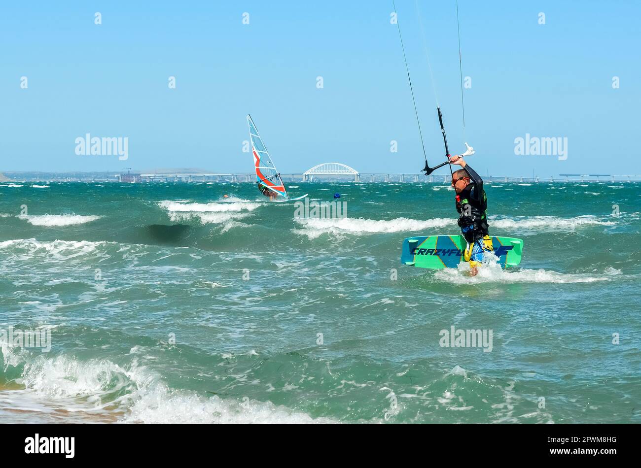 Aerial view. Kite surfing on the blue sea in the background of blue sky ...