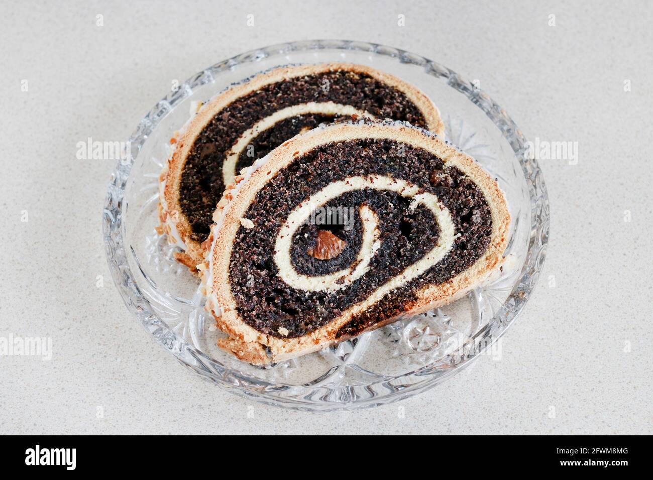 Slices of poppy-seed christmas cake. Festive dessert Stock Photo - Alamy