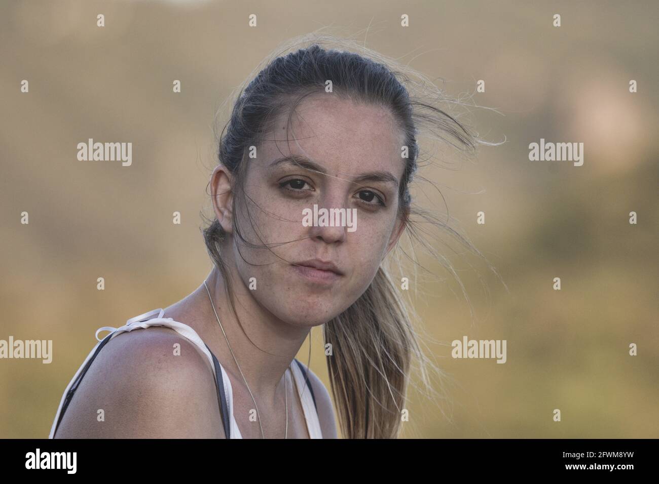 A young Spanish girl with blond hair in a ponytail outdoors Stock Photo ...