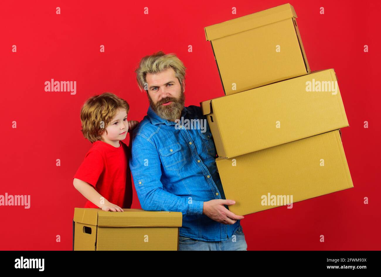 Delivery goods. Happy son and father with cardboard box. Internet ...