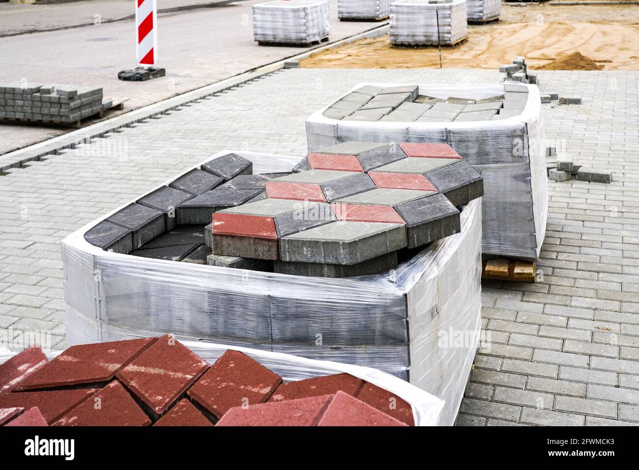 paving with paving slabs of different colors, view of the construction ...