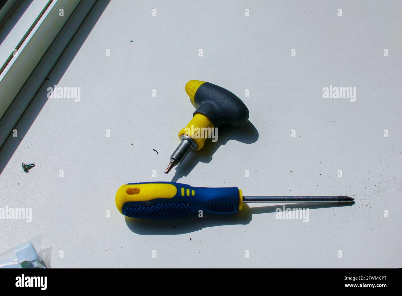 Screwdriver and special hammer for adjusting window blocks. Adjustment ...