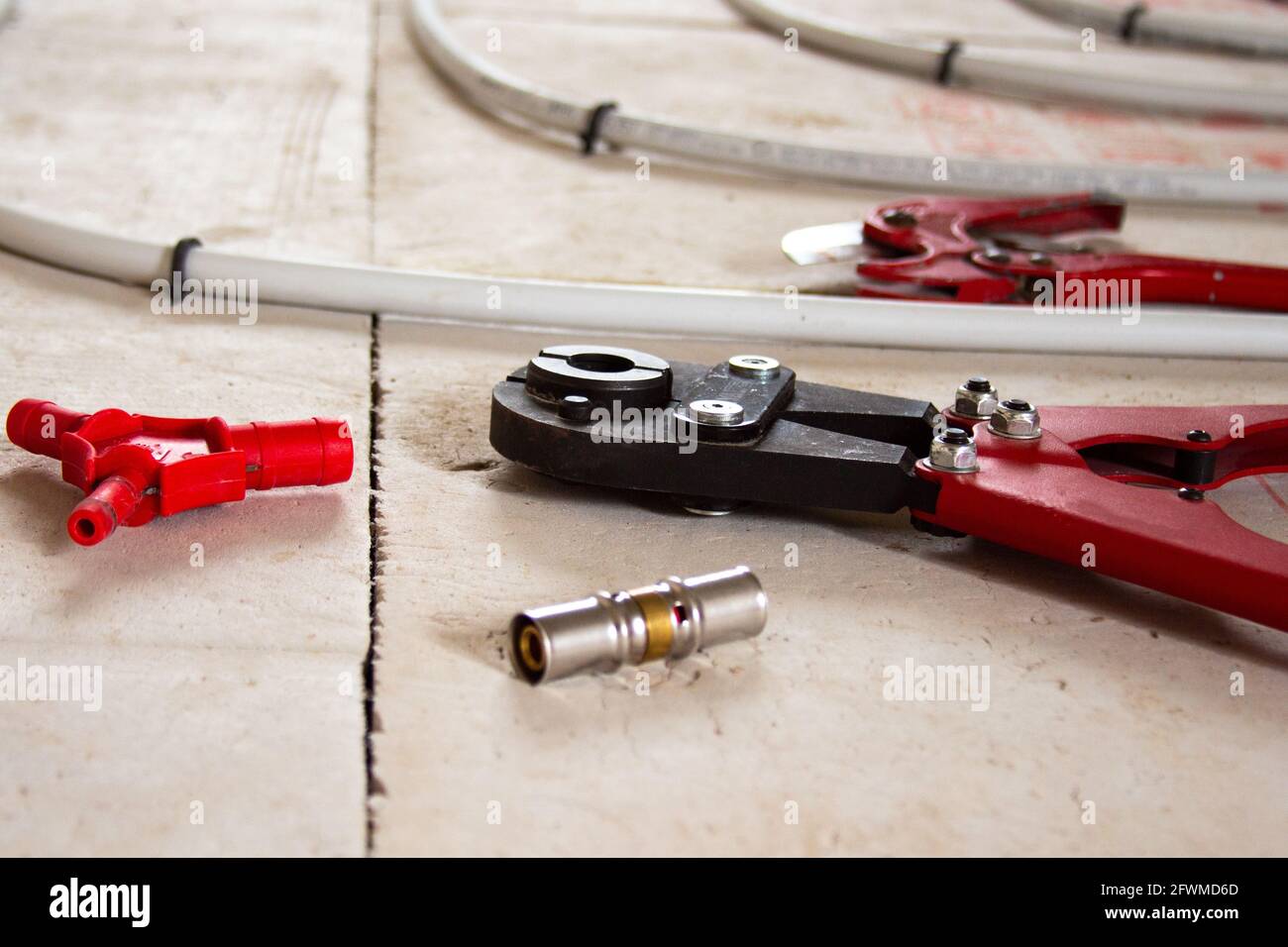 Plumbing concept. tools and pipes on a light background. Selective ...