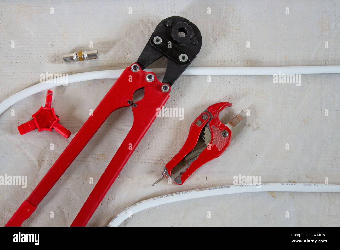 Plumbing concept. tools and pipes on a light background. view from ...