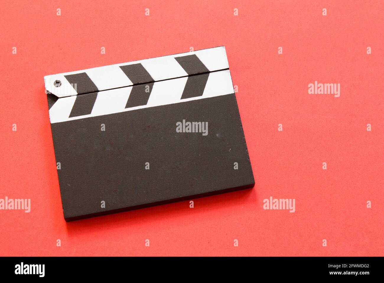 Movie clapper isolated on red background. Top view. Entertainment ...