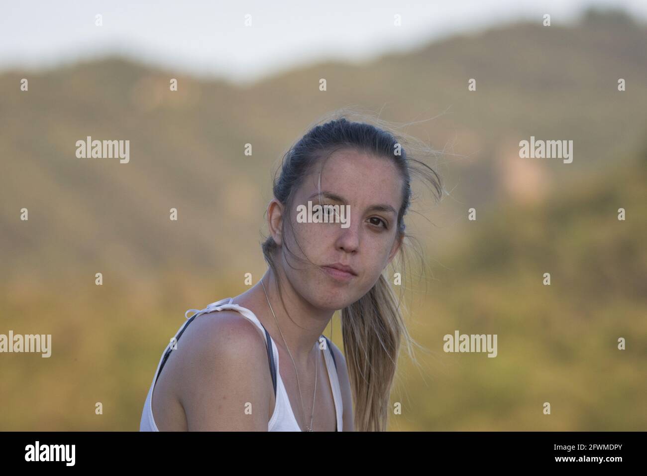 A young Spanish girl with blonde hair in a ponytail outdoors Stock ...