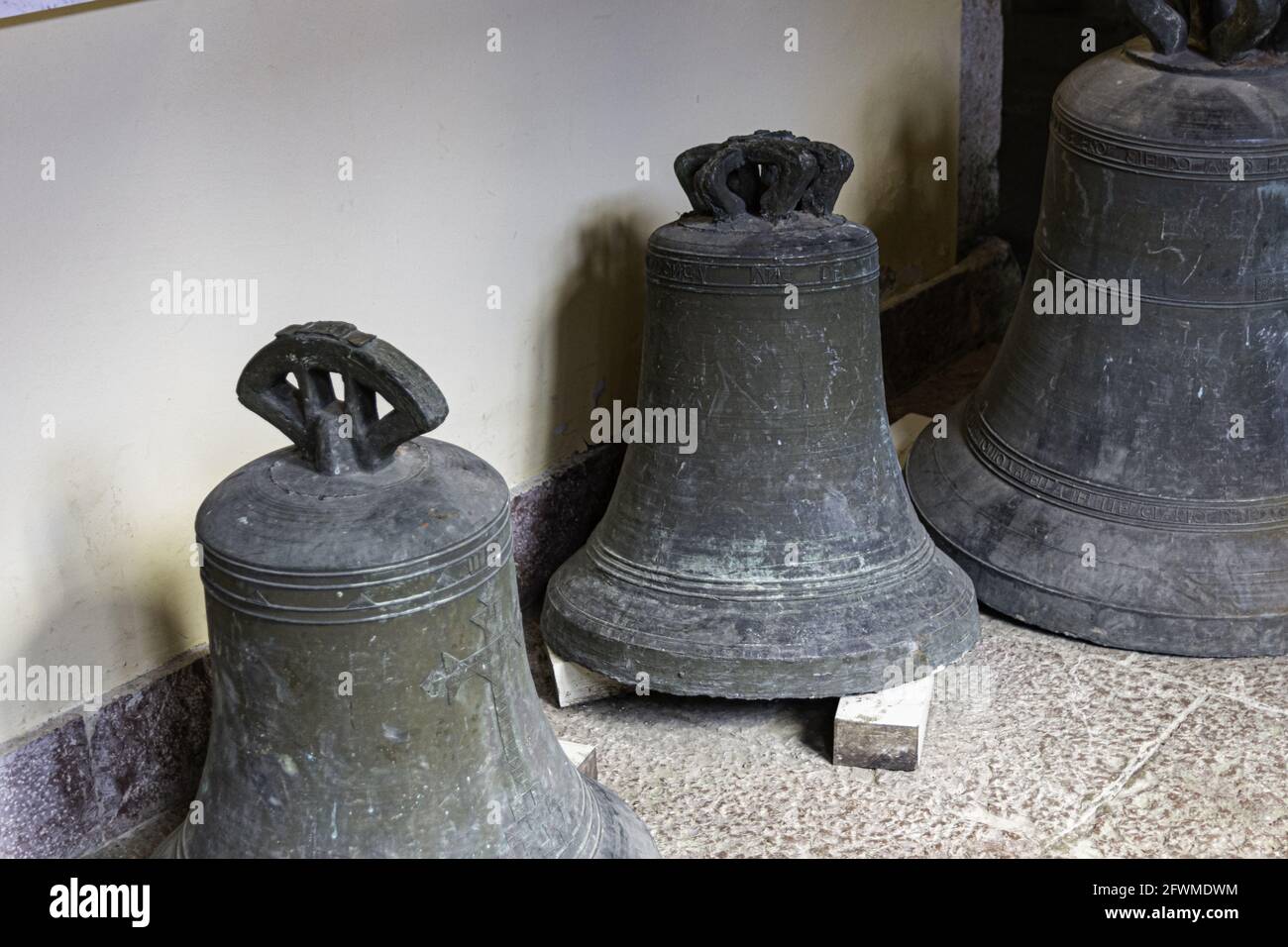 The old rusty church bells on the ground Stock Photo - Alamy