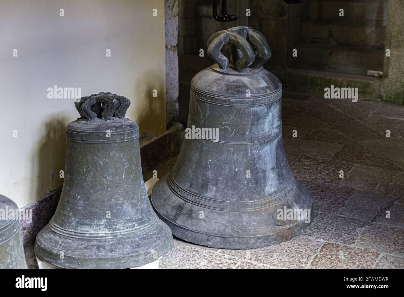 The old rusty church bells on the ground Stock Photo - Alamy