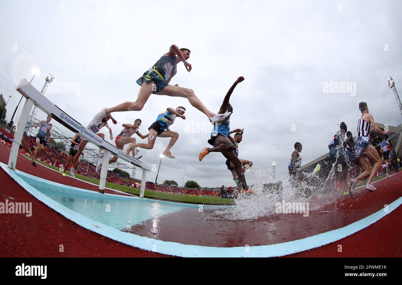 Runners Jump The Water Splash In The Men S 3000m Steeplechase At The