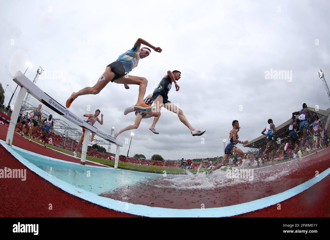 Runners Jump The Water Splash In The Men S 3000m Steeplechase At The